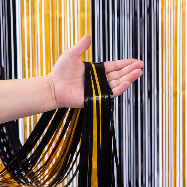 Gold Black Fringe Curtain displayed at a party