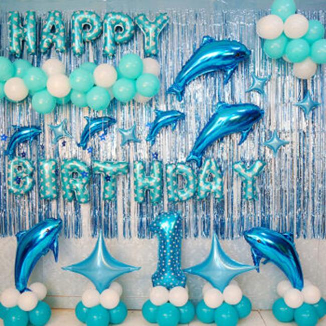 Metallic foil fringe curtain displayed as party backdrop