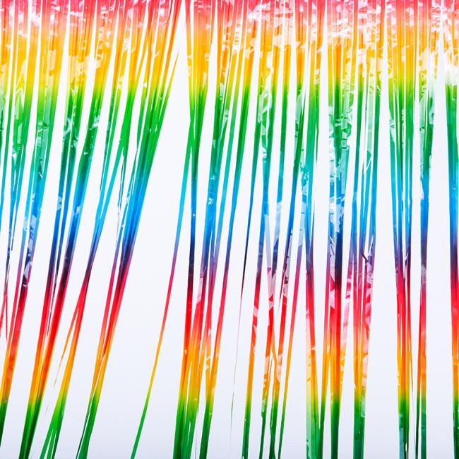 Colorful fringe backdrop in macaron colors displayed at a party