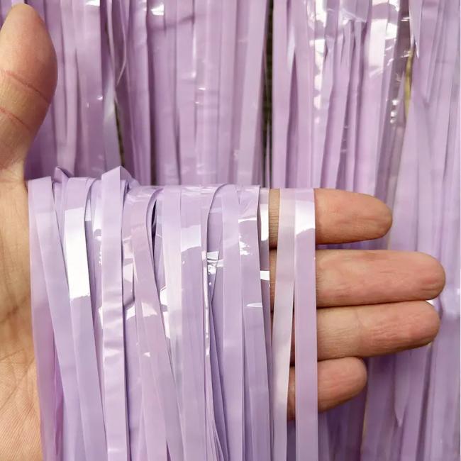 Fluorescent pink fringe curtain displayed as party backdrop