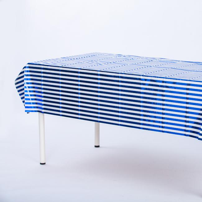 Stripped blue disposable tablecloth on dining table