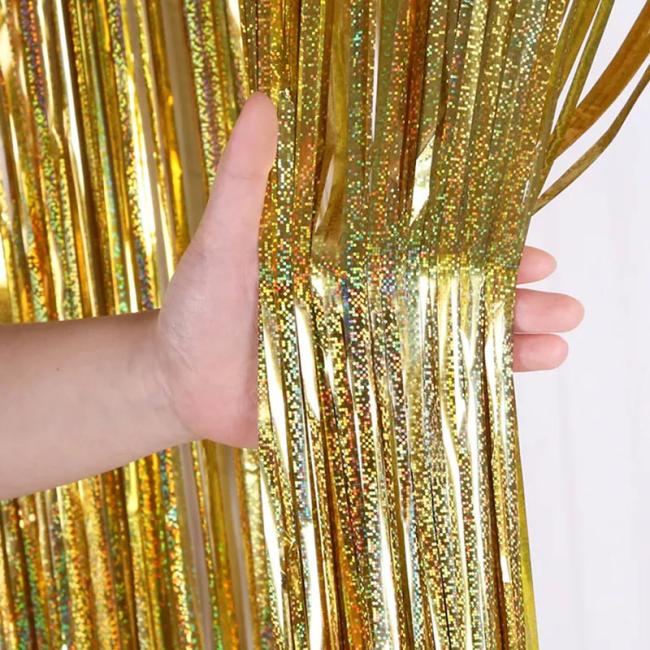 Gold foil fringe curtain display showing full length and shimmer effect