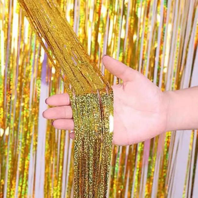 Close-up view of metallic tinsel fringe curtain texture