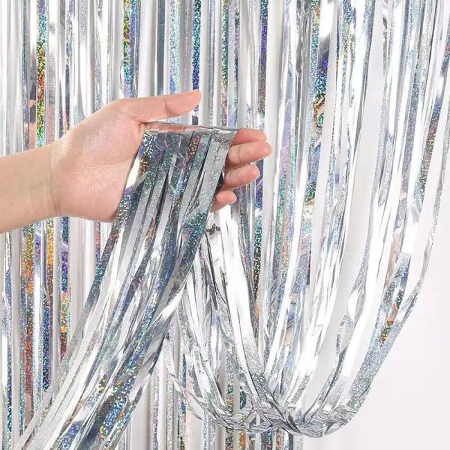Laser foil fringe curtain in festive decoration setting