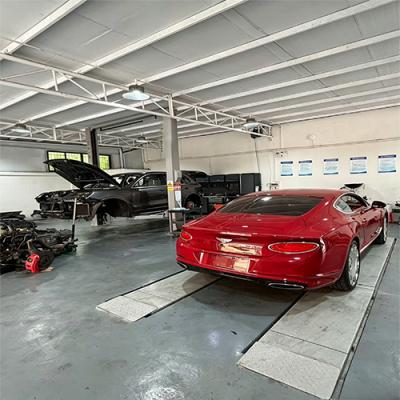 China Robust Car Lifting Equipment with Barrier Free Base and Manual Release System Supporting 9900lbs Load for Automotive Servicing for sale