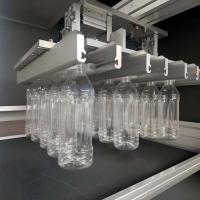 China Fully Automatic PLC Control Stainless Steel Empty Bottle Packing Machine for Plastic Bottles for sale