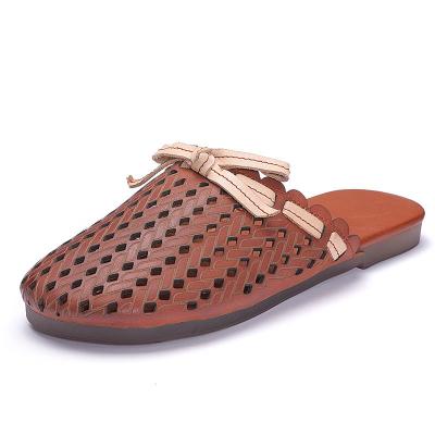 China S060 Summer new leather lace bowknot retro handmade round head hollow flat bottom female sandals for sale