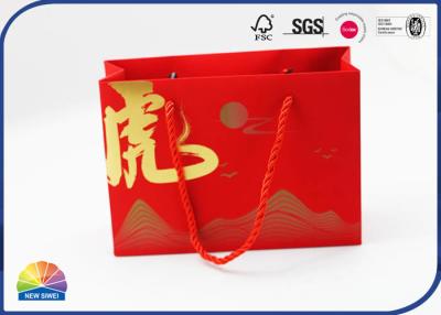 China Pantone Color Printed Paper Gift Bag Gold Stamping With Handle for sale