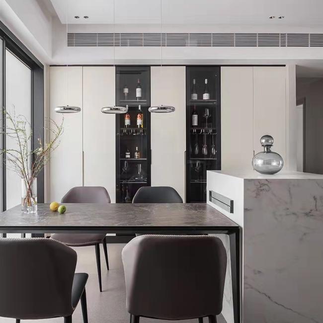 Close-up view of dining table and bench with slatted design showing craftsmanship