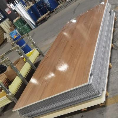 China Bamboo Charcoal Wood Veneer Board Mirror Siding Fire Proof Pvc Wall Panel For Apartment Office for sale