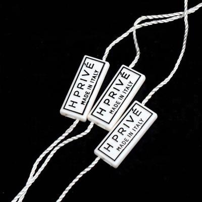 Cina Nylon String Custom Embossing Brand Logo Plastic Hang Tag String Locks for Garment Accessories in vendita