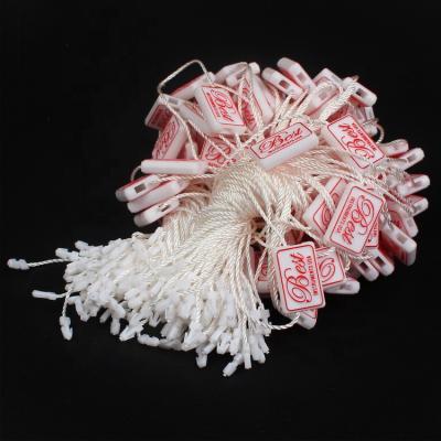 Cina Custom Double Side Design Logo Plastic Seal Tag with White Nylon String in vendita