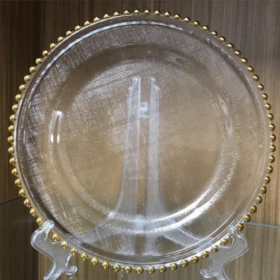 China New arrival decorative cold mark gold beaded glass charger plates wholesale for sale