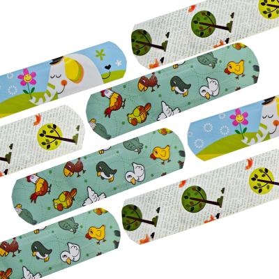 China Custom Logo Printing Kids Cartoon Plasters Adhesive Band Aid Bandaid in Paper Card Sleeve Wholesale Plastic PE for sale