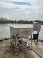 China Automatic Timer Motorized Fish Feeder Feed Loading Machine 45 Packs Per Hour System for sale