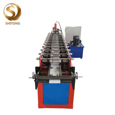 China Hot sale color channel roller steel shutter door roll forming machine for sale