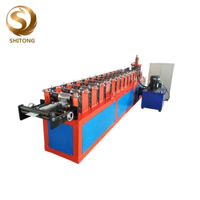 China Hot sale color channel roller steel shutter door roll forming machine for sale