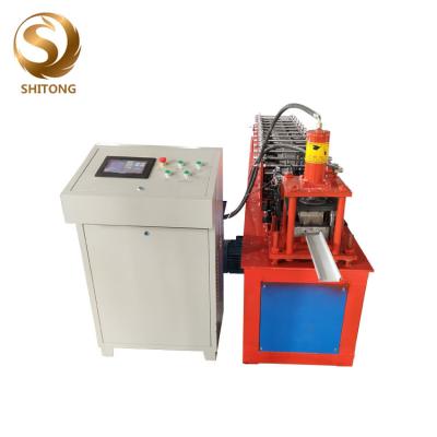 China Hot sale color channel roller steel shutter door roll forming machine for sale