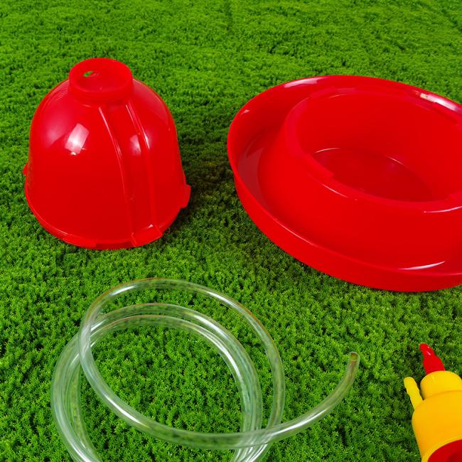 Sun Never Sets cone-shaped poultry drinker in red color