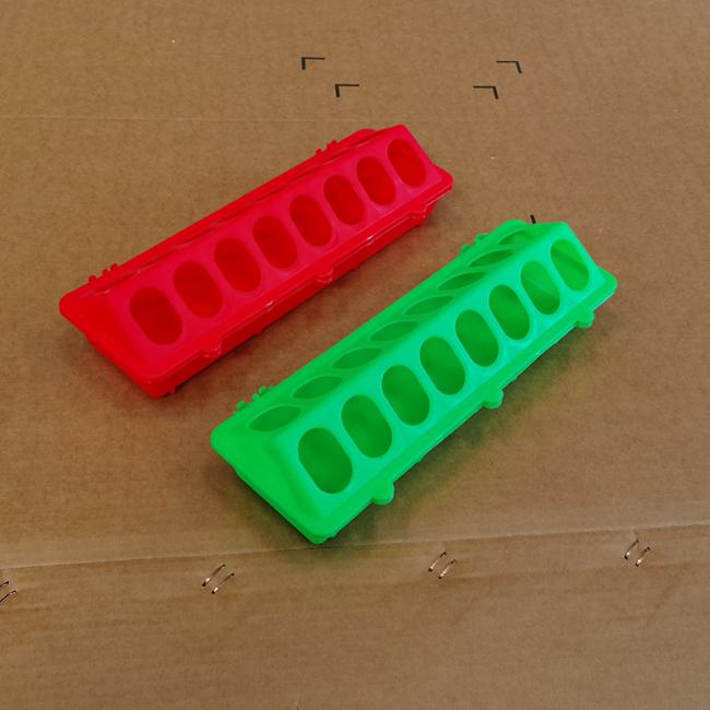Modern rectangular poultry feeding trough in red and yellow colors