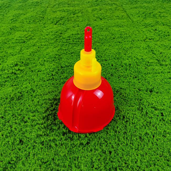 Poultry drinker in use with chickens