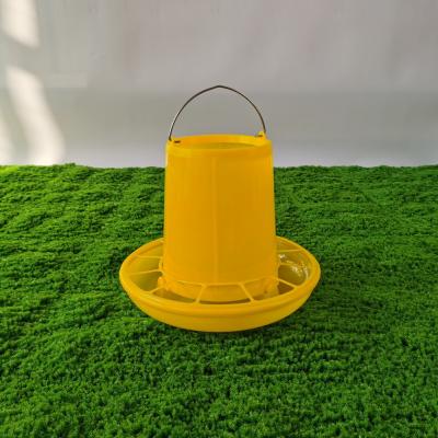 China Yellow Round Plastic Poultry Ration Feeding Bucket 5 Gallon for sale
