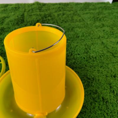China Yellow Round Plastic Poultry Ration Feeding Bucket 5 Gallon for sale