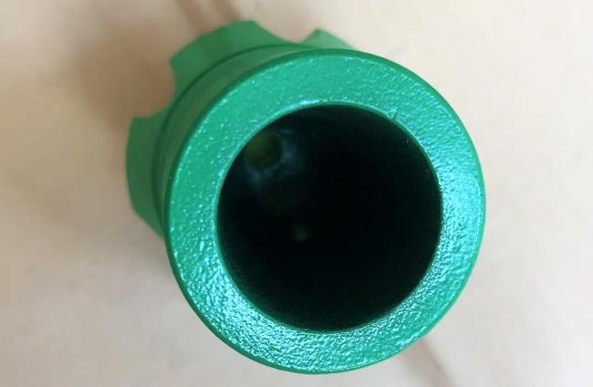 Close-up of tapered button bit