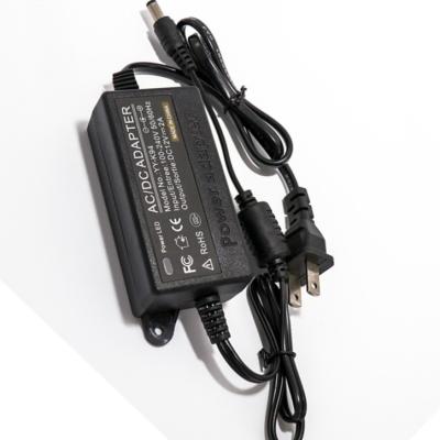 China Black C-Power AC100-240V DC 12V 2A Adaptador de alimentação de tomada montado na parede 12Volt para UE AU Reino Unido EUA à venda