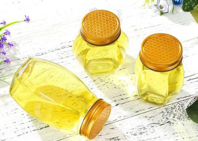 China Característica de vidro sextavada oval de Honey Jars Transparent Color Moistureproof à venda