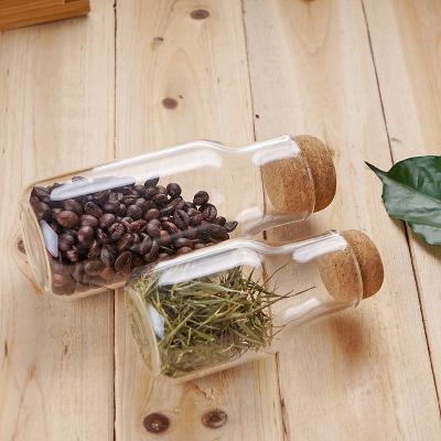 Cina 150 ml di vetro decorativo di 330 ml imbottigliano/barattoli di vetro di stoccaggio con Cork Lid in vendita