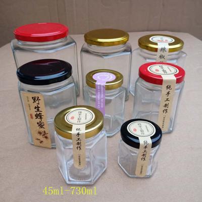 Cina Bottiglia sigillata senza piombo di vetro esagonale del contenitore di alimento di Honey Jars 45ml-730ml in vendita