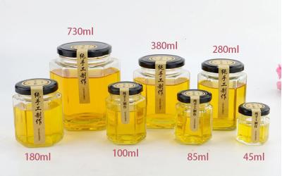 Cina Bottiglia sigillata senza piombo di vetro esagonale del contenitore di alimento di Honey Jars 45ml-730ml in vendita