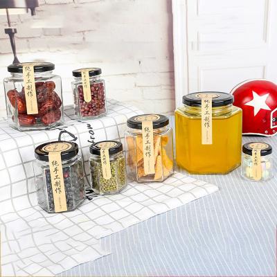 Cina Barattoli di vetro a forma di esagonali di stoccaggio del coperchio a vite, inceppamento Honey Jars di vetro della spezia in vendita
