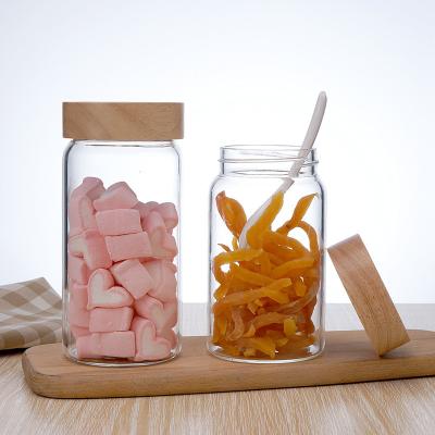 Cina I barattoli di vetro vuoti dell'alto borosilicato ventilano i contenitori stretti dei barattoli di stoccaggio con il coperchio di legno in vendita