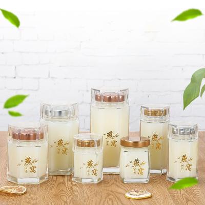 Cina Alto grado Honey Jars Clear Color With di vetro esagonale Eco amichevole in vendita