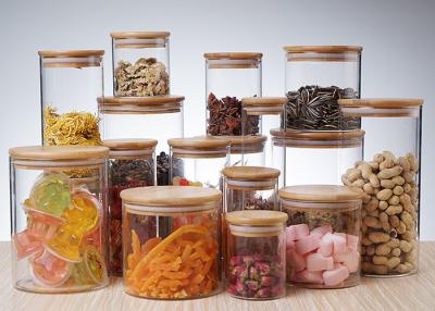 Cina Lo stoccaggio di vetro ermetico dell'alimento stona la forma rotonda Logo With Screw Wood Lid su misura in vendita