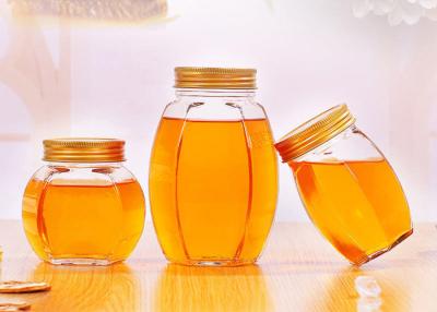 Cina Coperchio dorato di Honey Jars With Twist Off dell'inceppamento della bottiglia di vetro di vetro di esagono in vendita