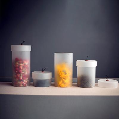 Cina l'alto barattolo del tè del vetro borosilicato di 300ml 700ml 900ml 1100ml ha glassato il barattolo di vetro di stoccaggio del coperchio in vendita