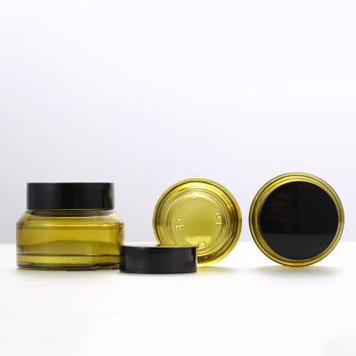 Cina il vetro del cosmetico della spalla di inclinazione di 30g 50g stona il barattolo di timbratura caldo della crema dell'occhio di vetro in vendita