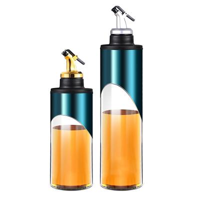 Cina Bottiglia rotonda vuota 380ml 650ml di vetro dell'erogatore dell'olio della cucina in vendita
