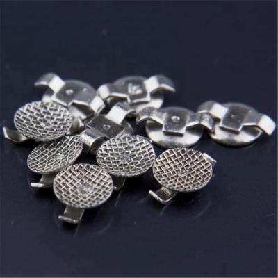 China CCC Certification metal button lingual round/ elliptical 10pcs per pack for dental orthodontic procedures made of metal for sale