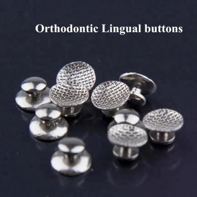 China CCC Certification metal button lingual round/ elliptical 10pcs per pack for dental orthodontic procedures made of metal for sale