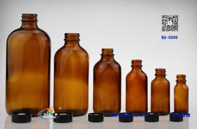 China Amber glass bottle Boston Round with black phenolic cone lined cap for sale