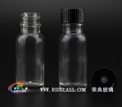 China 0.5oz clear boston round glass bottle with cone lined phenolic caps for sale