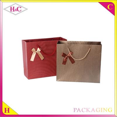 China Manufacture and sale  handle paper upscale cheaper  wine gift shopping bag with bowknot for sale
