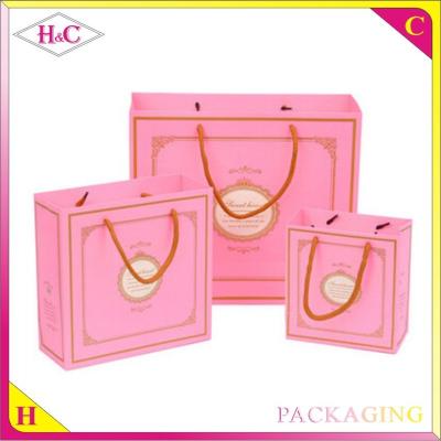 China European fashion hand length handle paperboard nuptial gift bag for sale