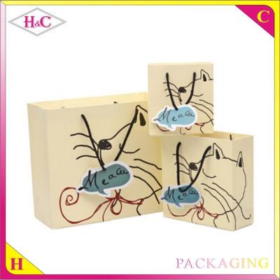 China Yellow cartoon cat and fish hand length handle paperboard gift bag for sale