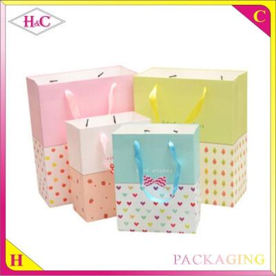 China Wholesale hand length handle paper packaging bag for sale