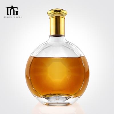 Cina Bottiglia di vetro a superficie liscia circolare irregolare su misura per la produzione di whisky gin da 700 ml in vendita